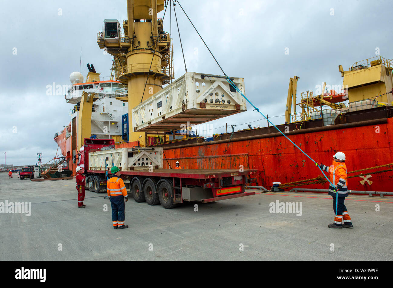 Normand Clipper berthing and putting ashore decommissioned oil rig ...