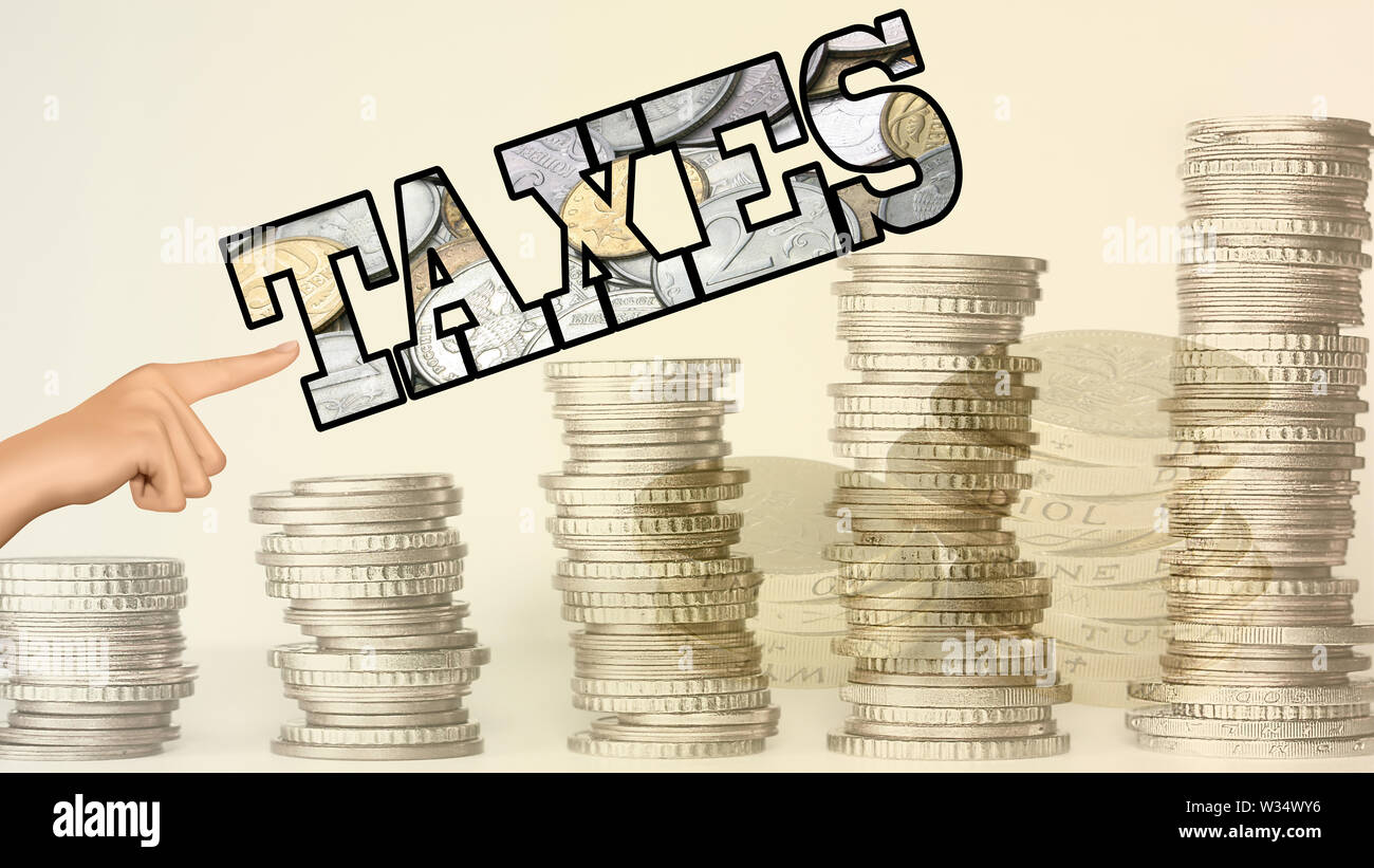 "TAXES" word with notes inscribed and coin stack in front. Pile of ...