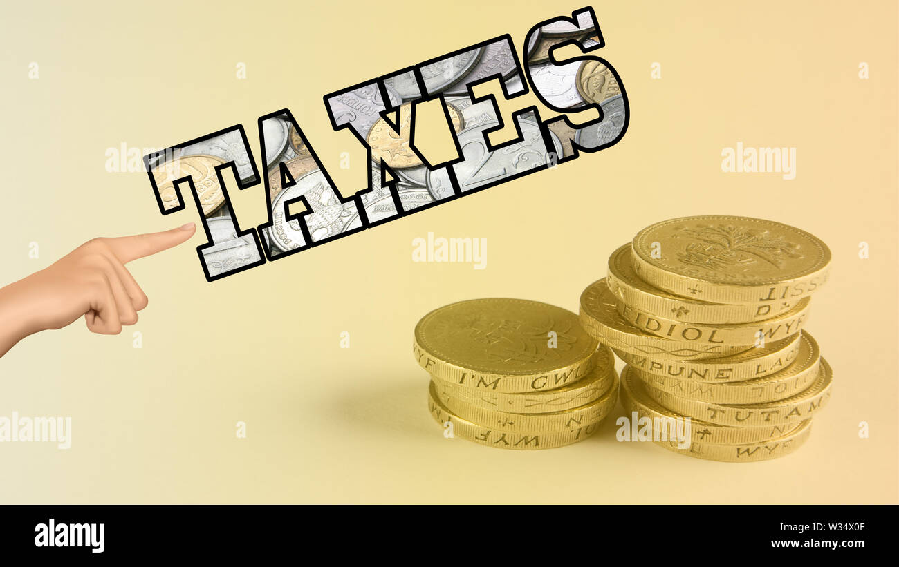 "TAXES" word with notes inscribed and coin stack in front. Pile of ...