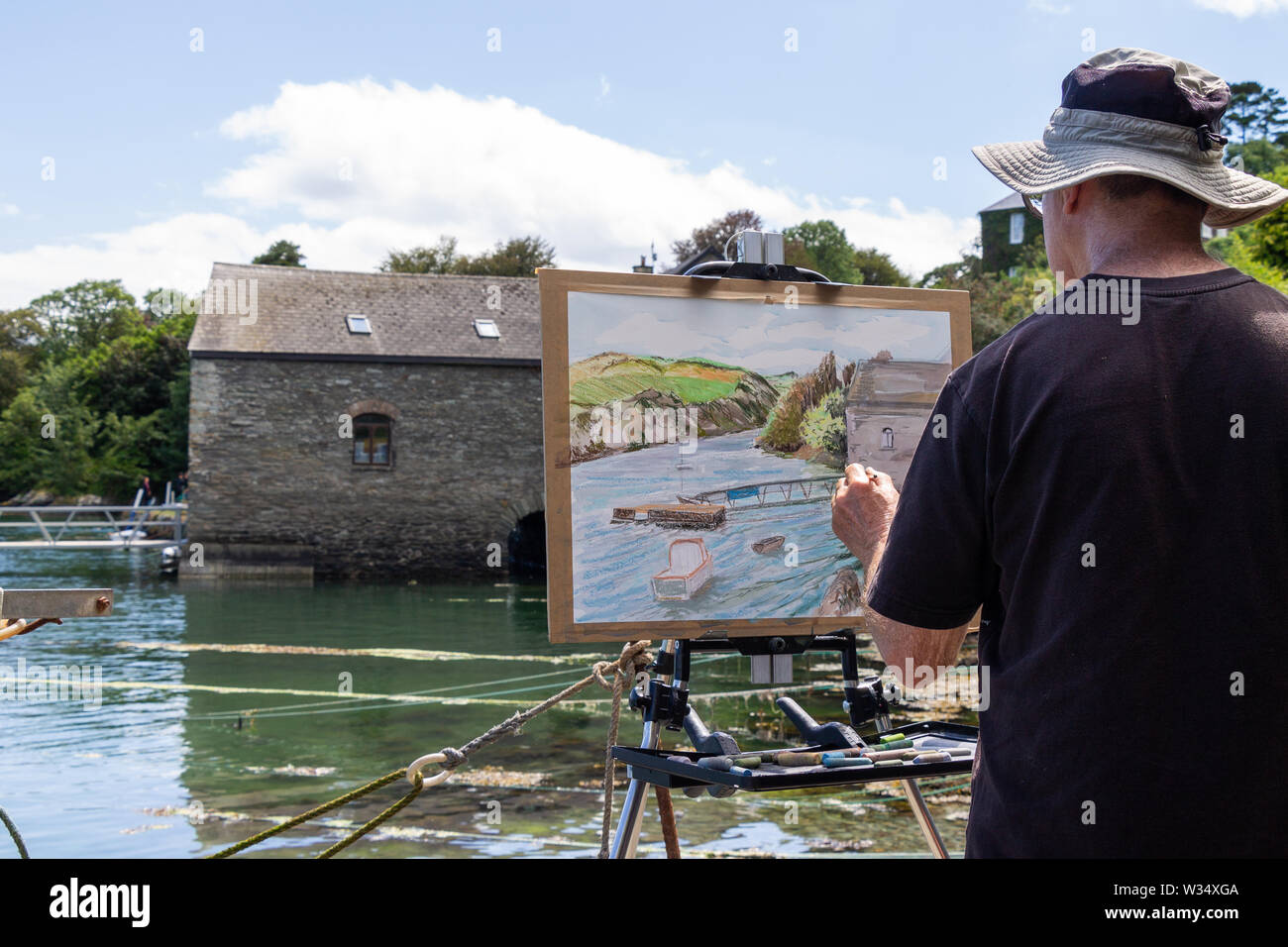 Male artist painting coastline scene Castlehaven,West Cork,Ireland ...