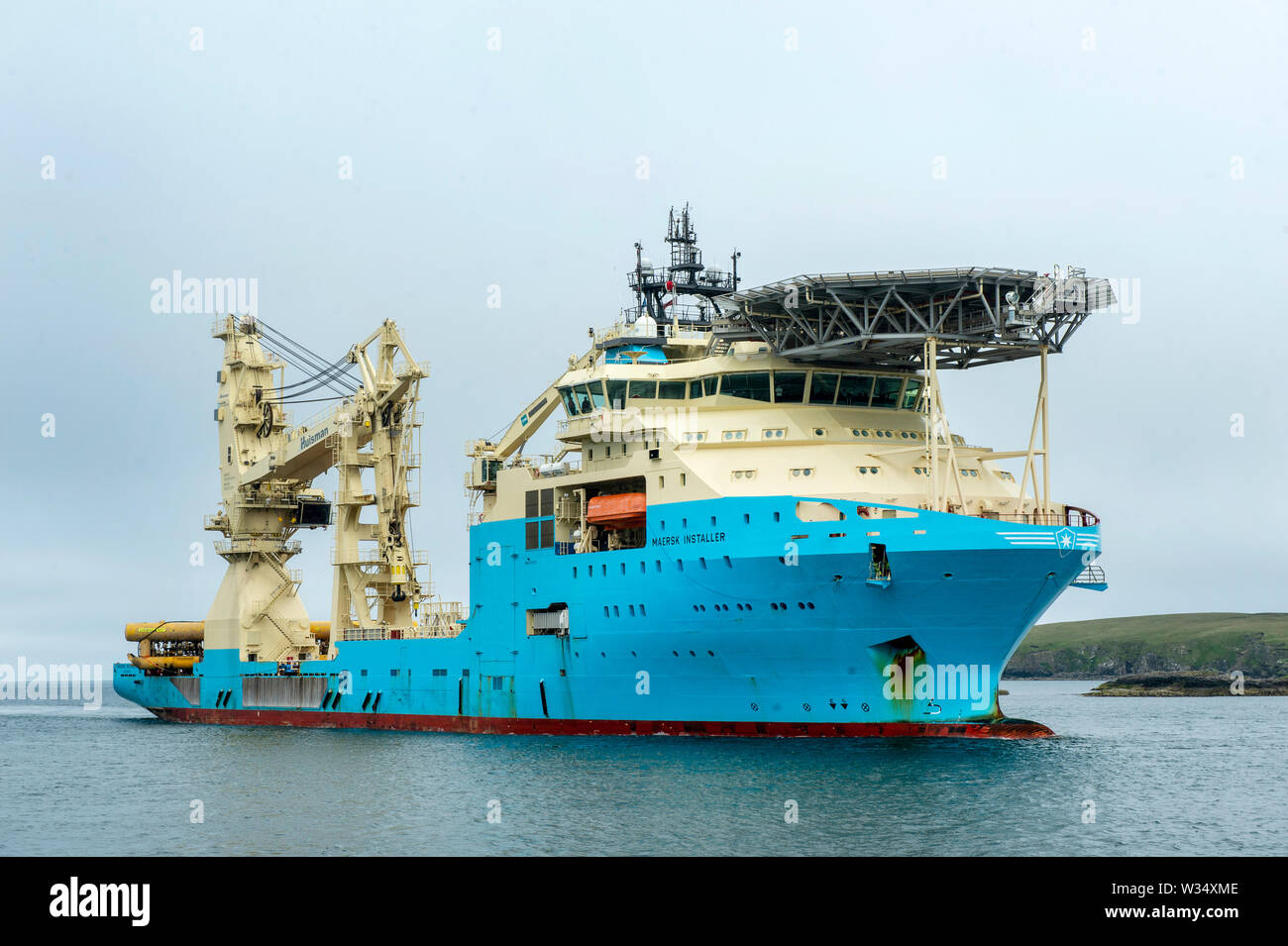 Maersk Installer berthing in Lerwick Shetland unloading by crane a ...