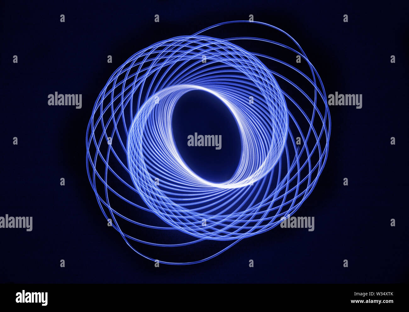 Light trails and patterns against black background Stock Photo - Alamy