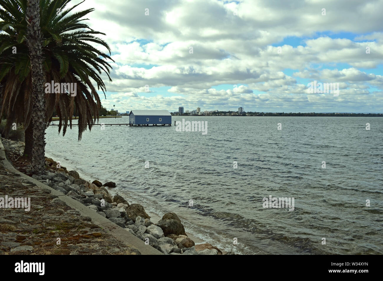 View of Crawley Edge Boatshed, Blue Boat House with blue sky and white ...