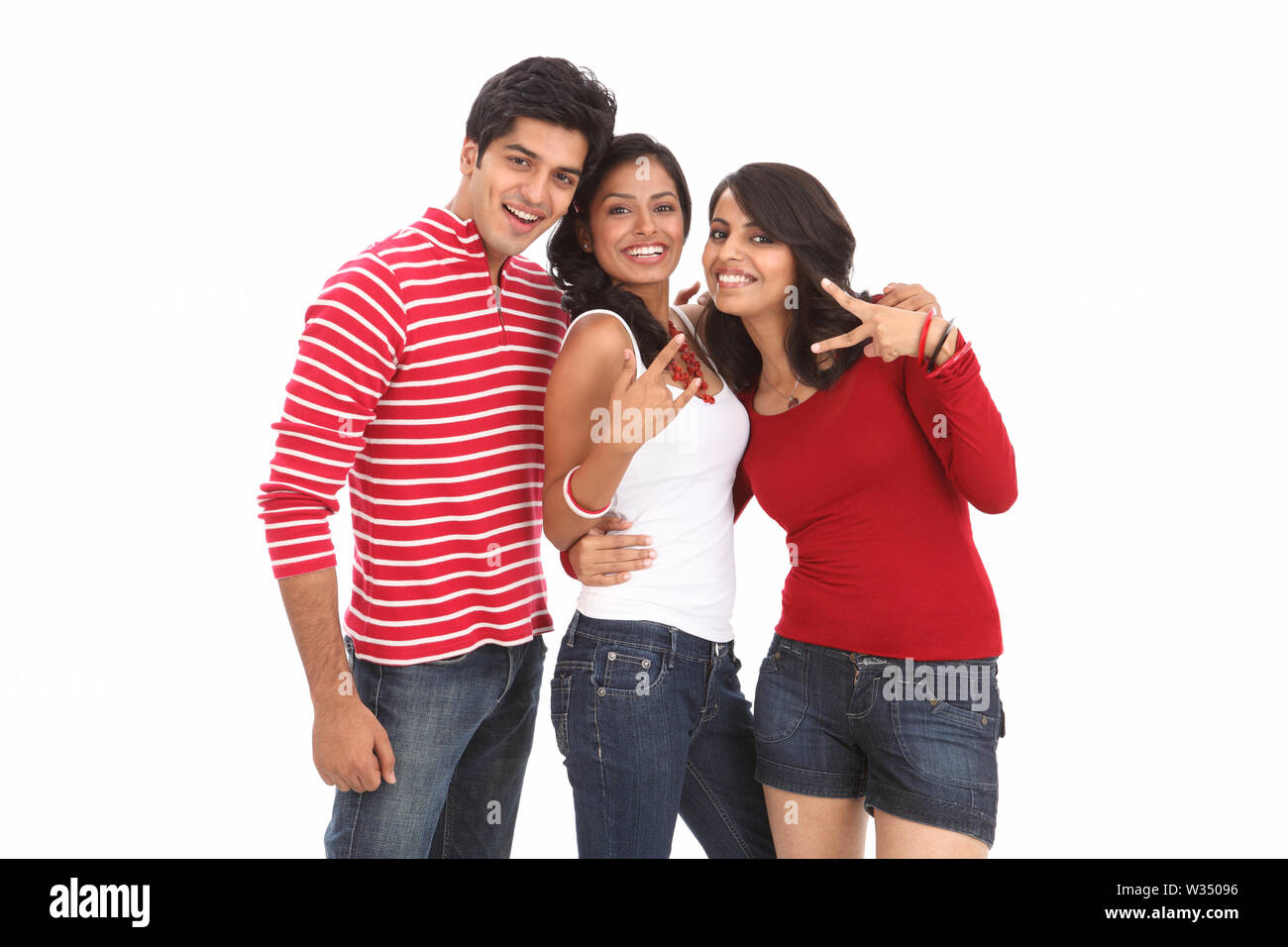 Portrait of three friends making hand signs Stock Photo - Alamy
