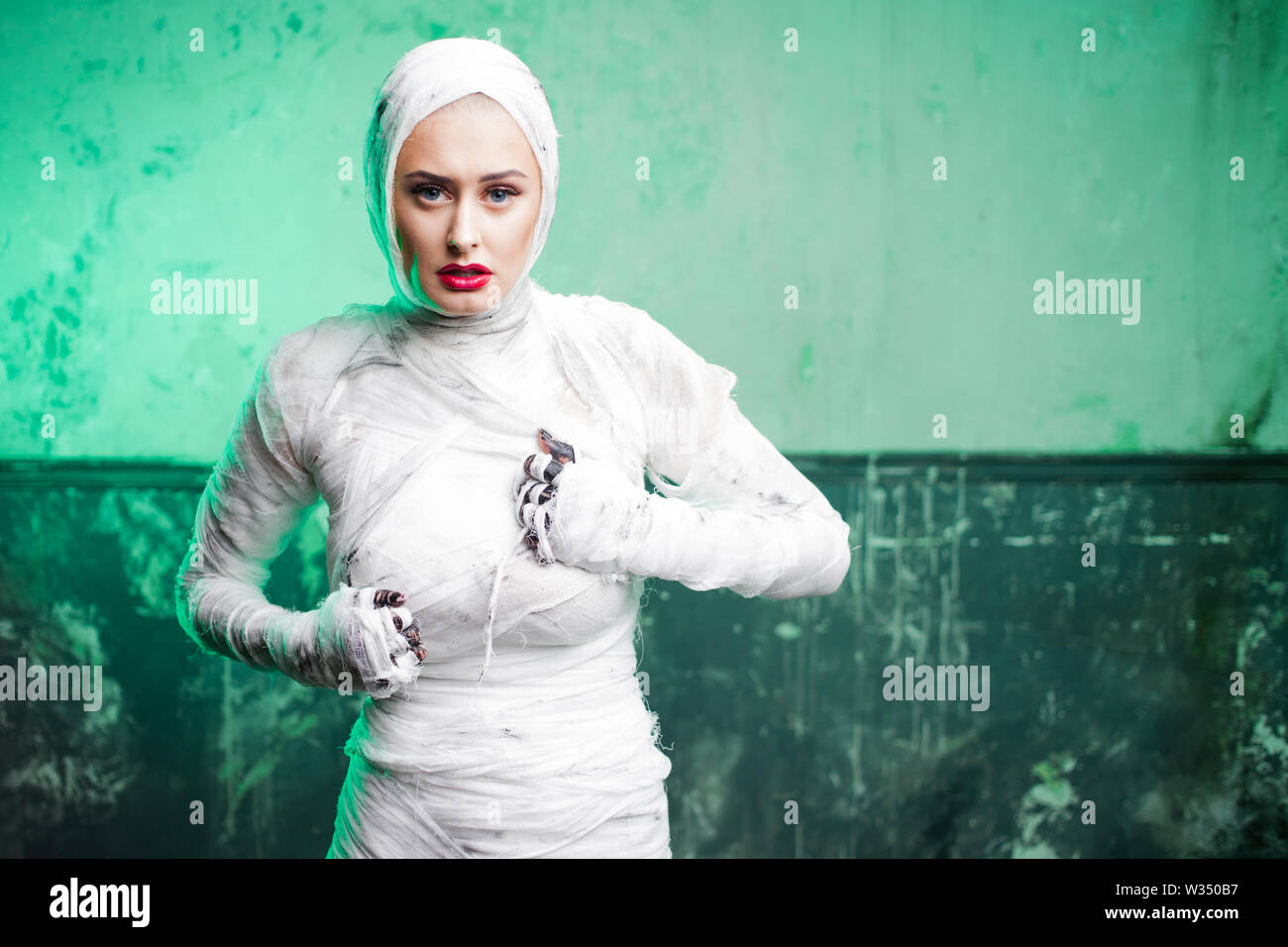 Glamorous mummy. Portrait of a young beautiful woman in bandages all ...