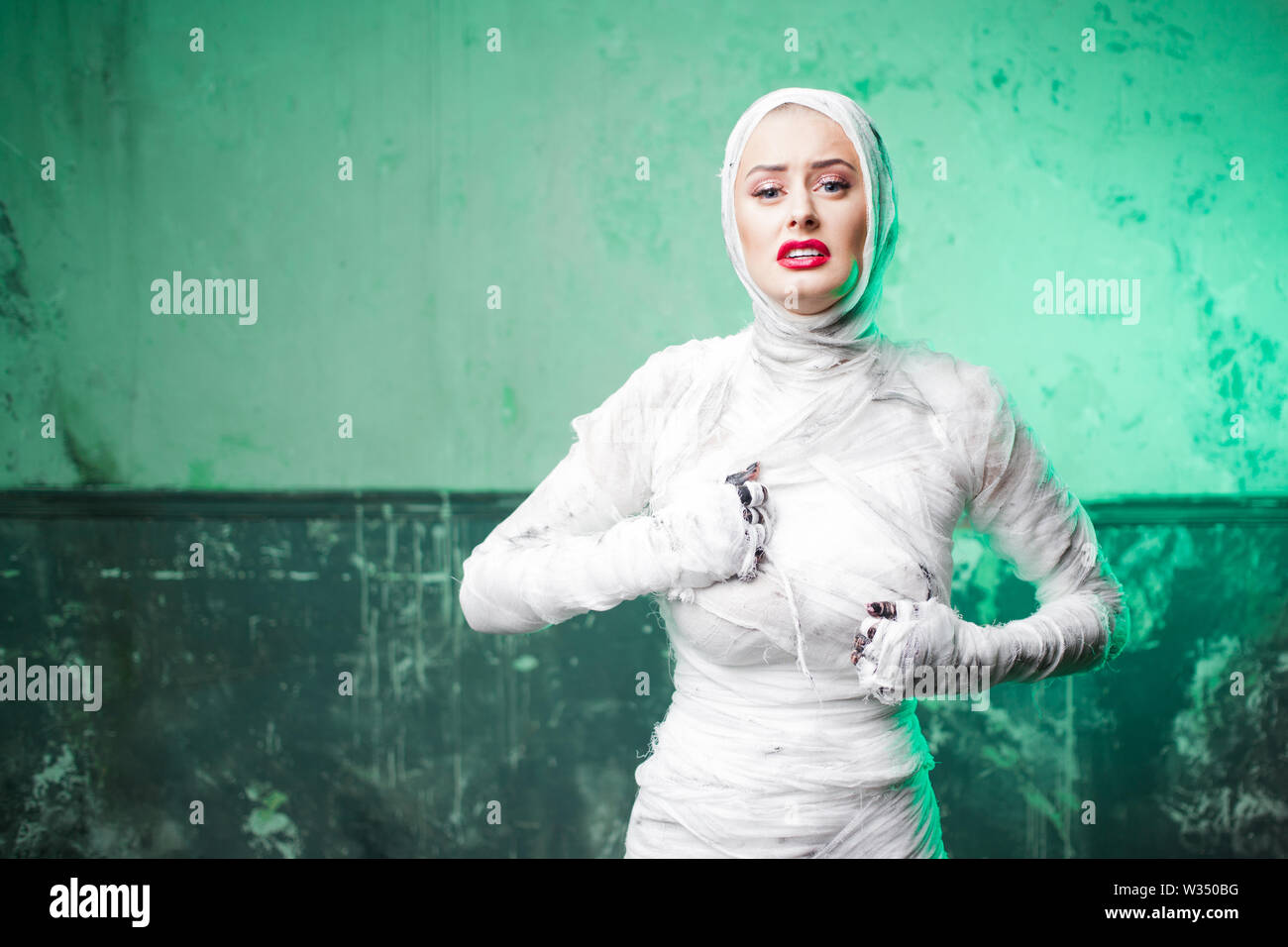 Glamorous mummy. Portrait of a young beautiful woman in bandages all ...