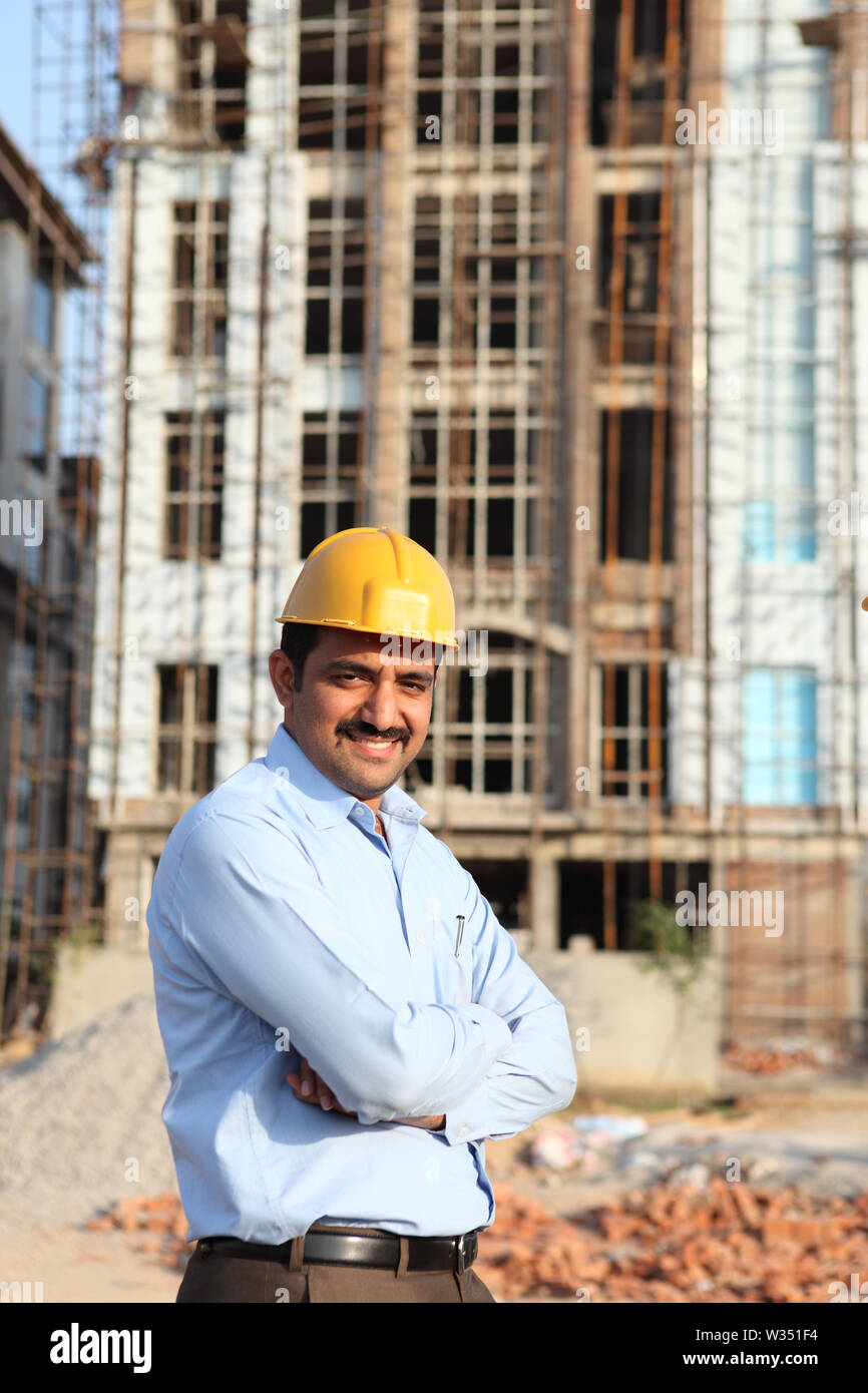 Portrait of an engineer at a construction site Stock Photo - Alamy