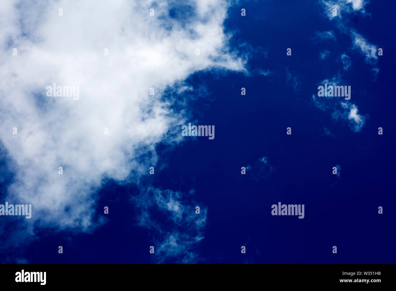 Deep blue sky with clouds high quality Stock Photo - Alamy