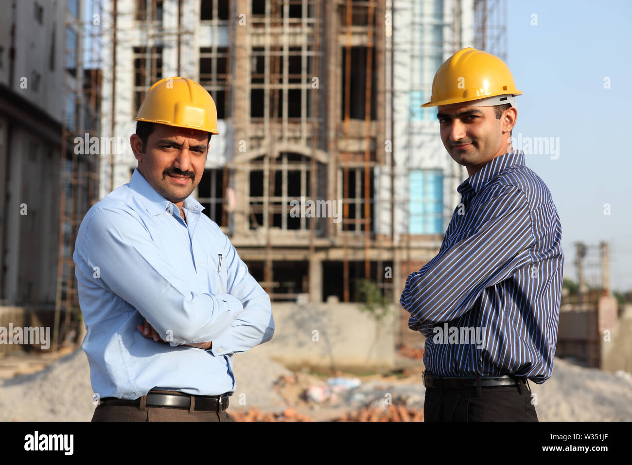 Portrait of two engineers at a construction site Stock Photo - Alamy