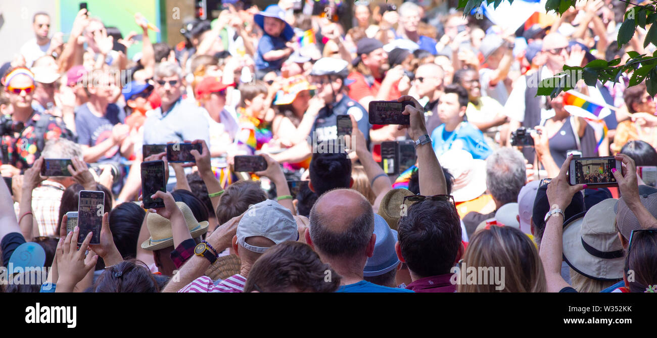 Cell phones photographing parade Stock Photo - Alamy