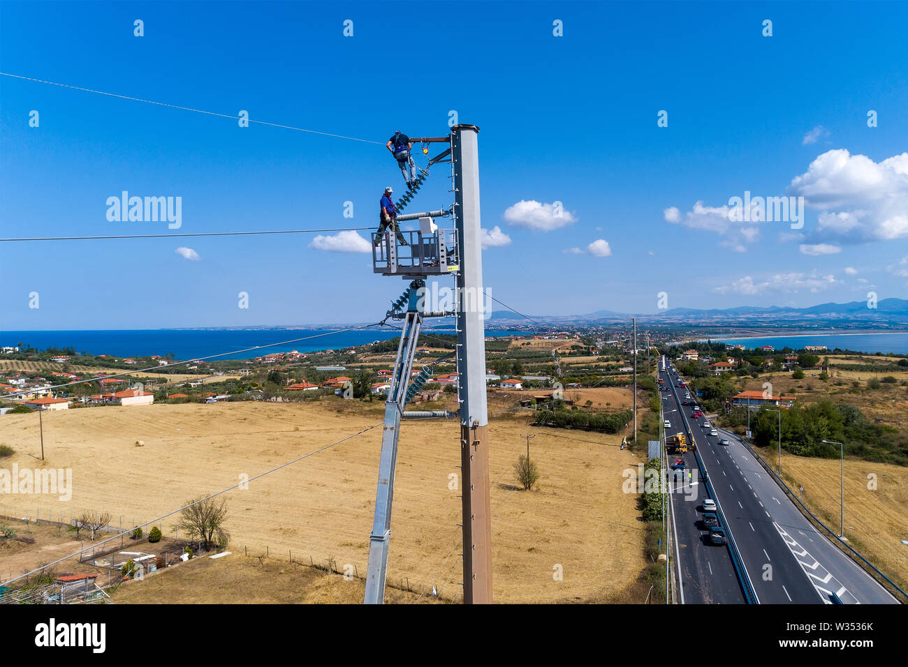 Lineman climbing ladder power pole hi-res stock photography and images ...