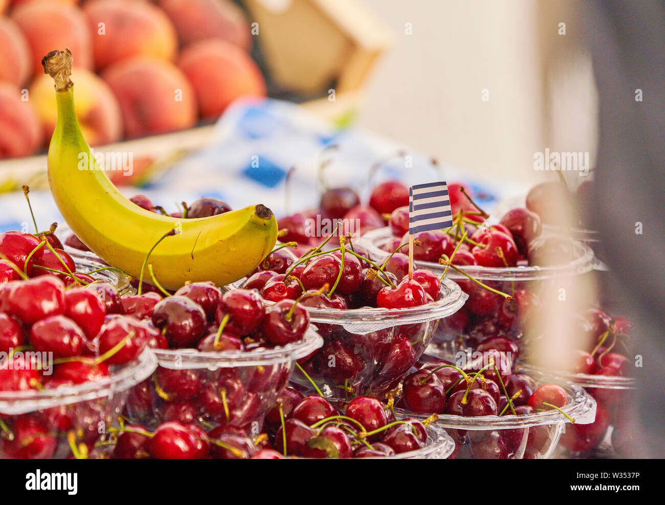 Fruit stand with bananas and cherries in Oia, Santorini , Greece at 04 ...