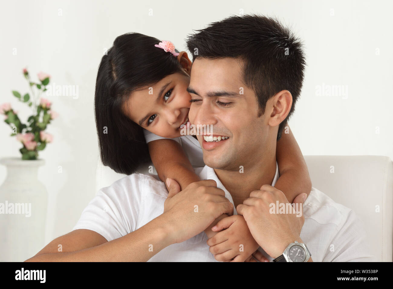 Daughter hugging father from behind hi-res stock photography and images ...