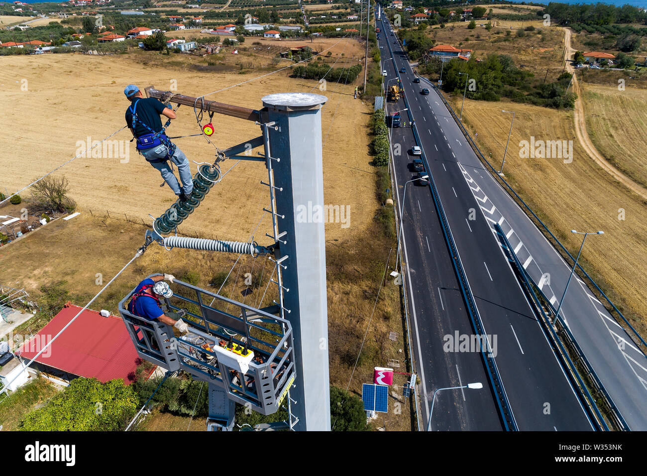 Lineman climbing ladder power pole hi-res stock photography and images ...