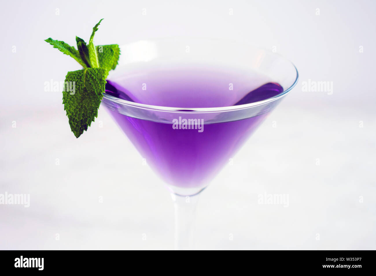 Purple Cocktail with Mint Garnish Stock Photo - Alamy