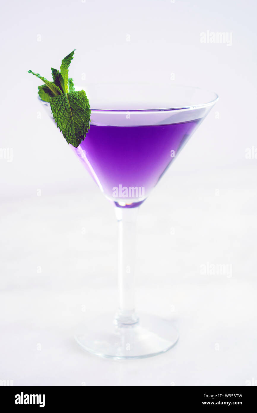 Purple Cocktail with Mint Garnish Stock Photo - Alamy