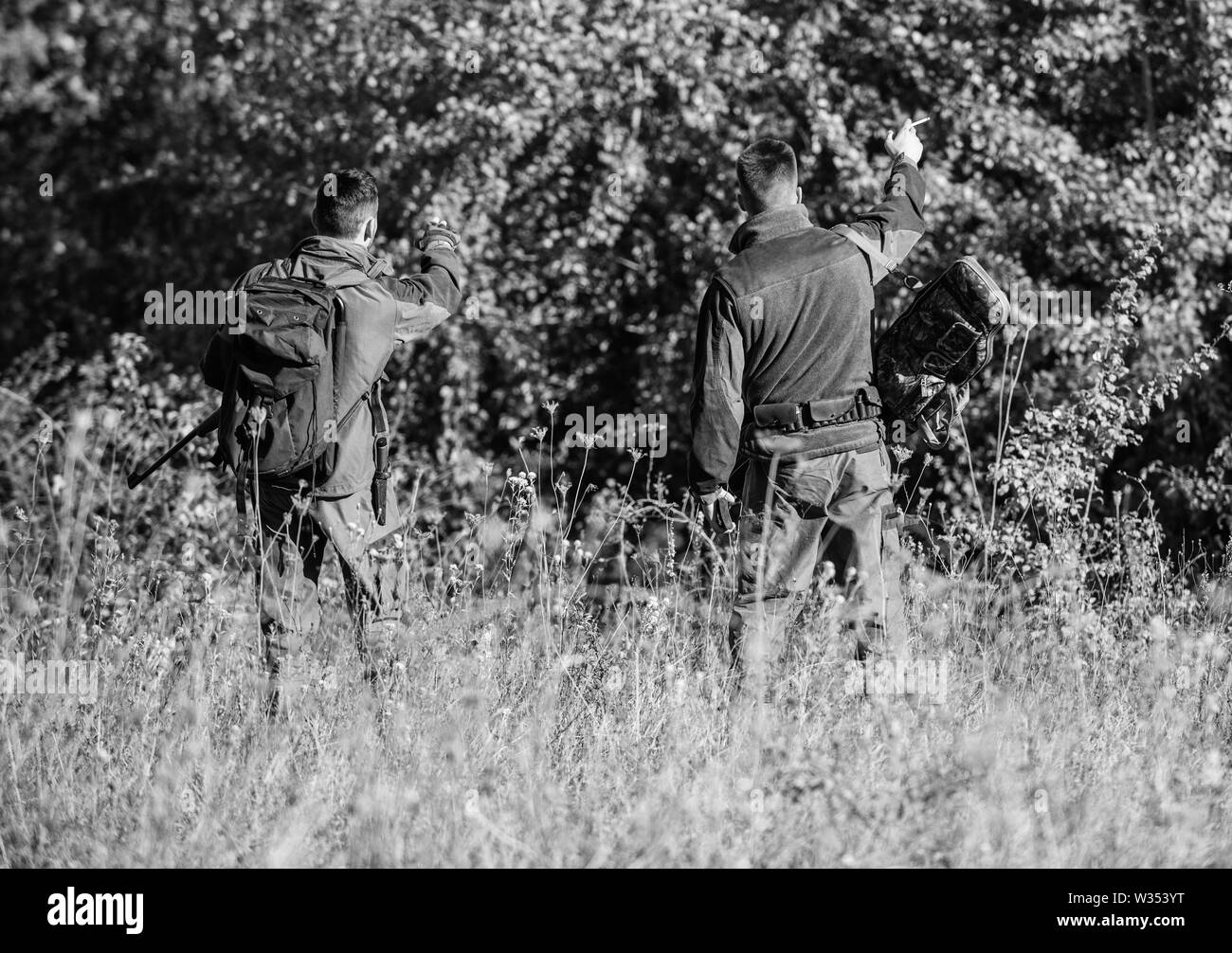 Man hunters with rifle gun. Boot camp. Hunting skills and weapon ...