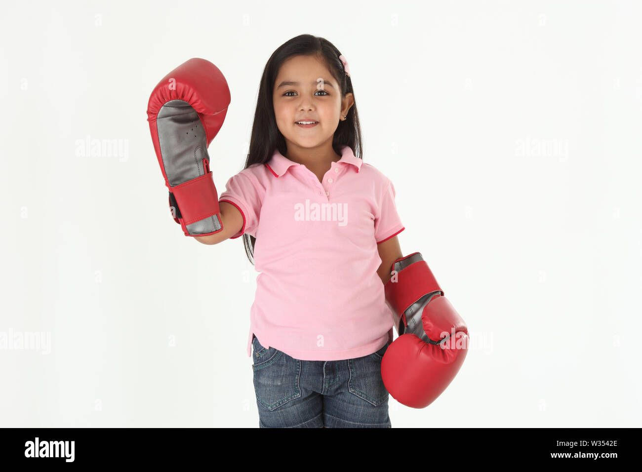 Portrait of a girl wearing boxing gloves and smiling Stock Photo - Alamy