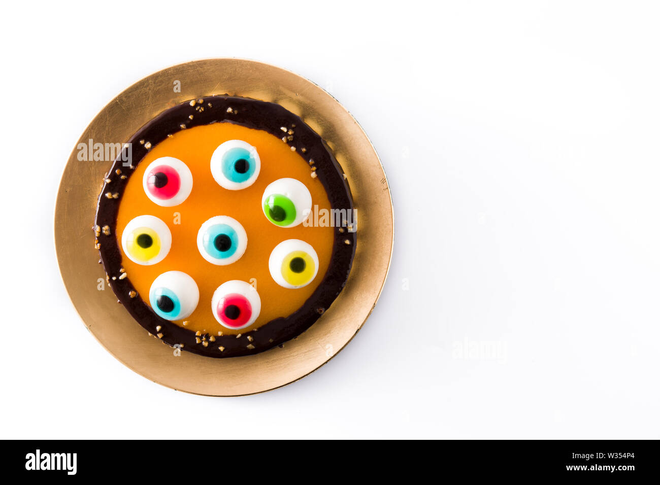 Halloween cake with candy eyes decoration isolated on white background ...