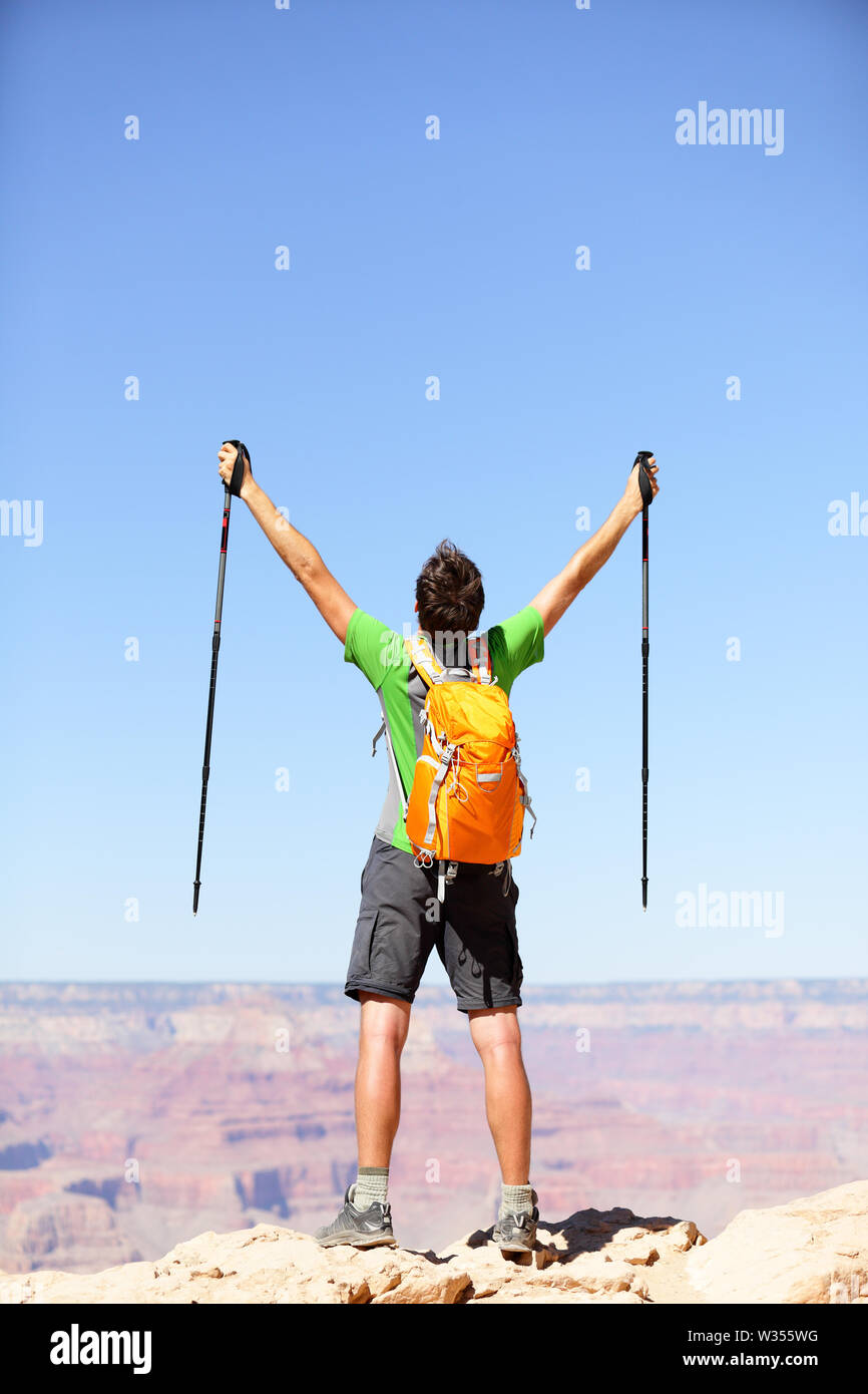 Celebrating success winner hiker cheering happy. Man hiking reaching ...