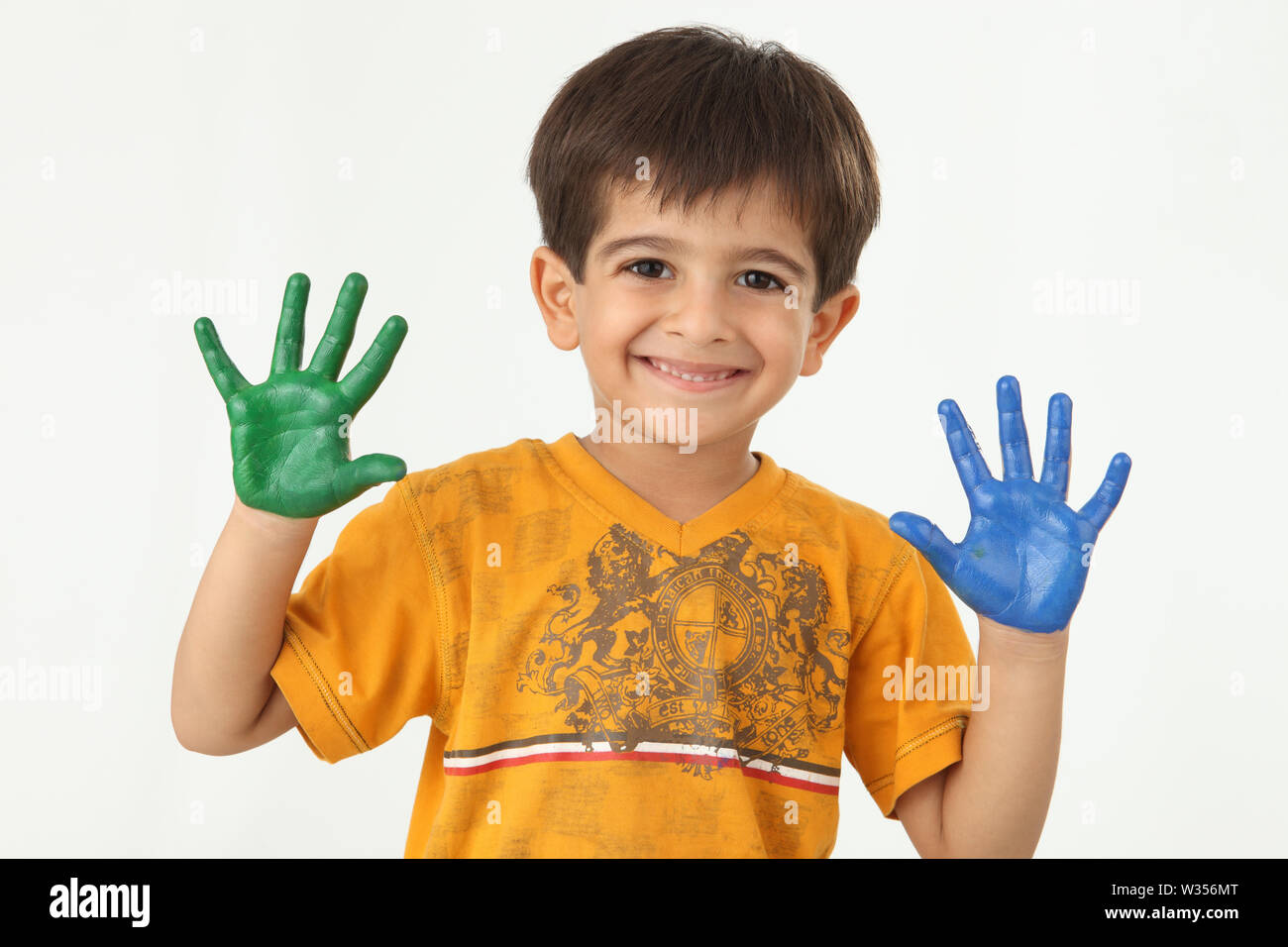 Portrait of a boy with painted hands Stock Photo - Alamy