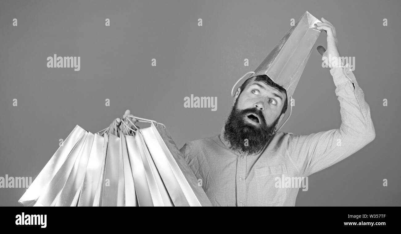 Bearded man with retarded face and open mouth wearing paper bag on his ...