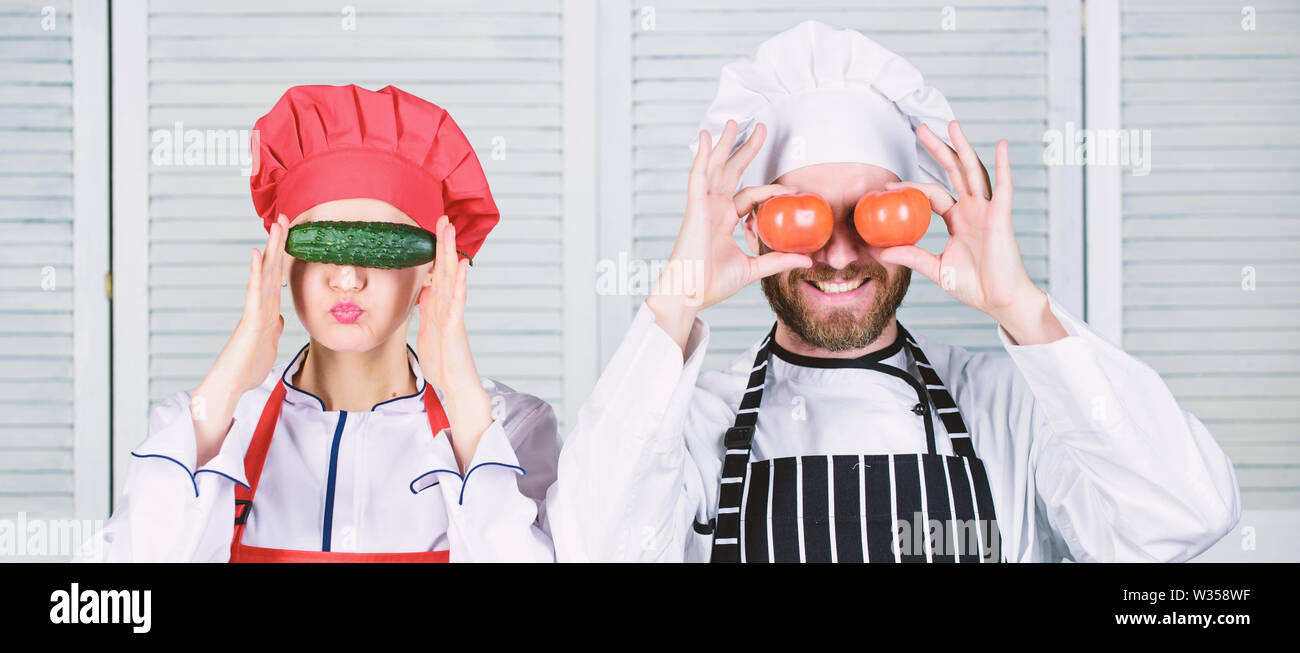 Providing amounts of vitamin. Senior chef and kitchen maid holding ...