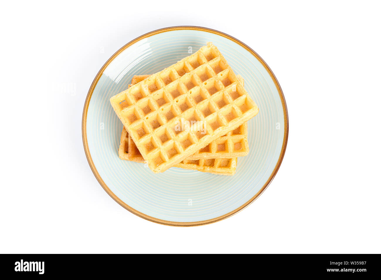 Belgian waffles on plate isolated on white background Stock Photo - Alamy