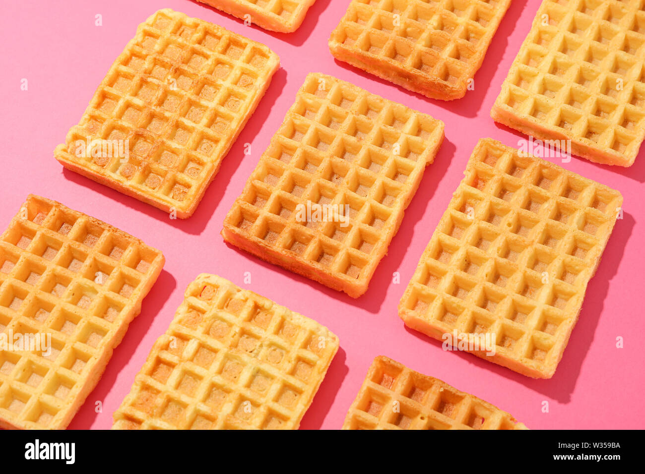 Flat lay composition with belgian waffles on color background Stock ...