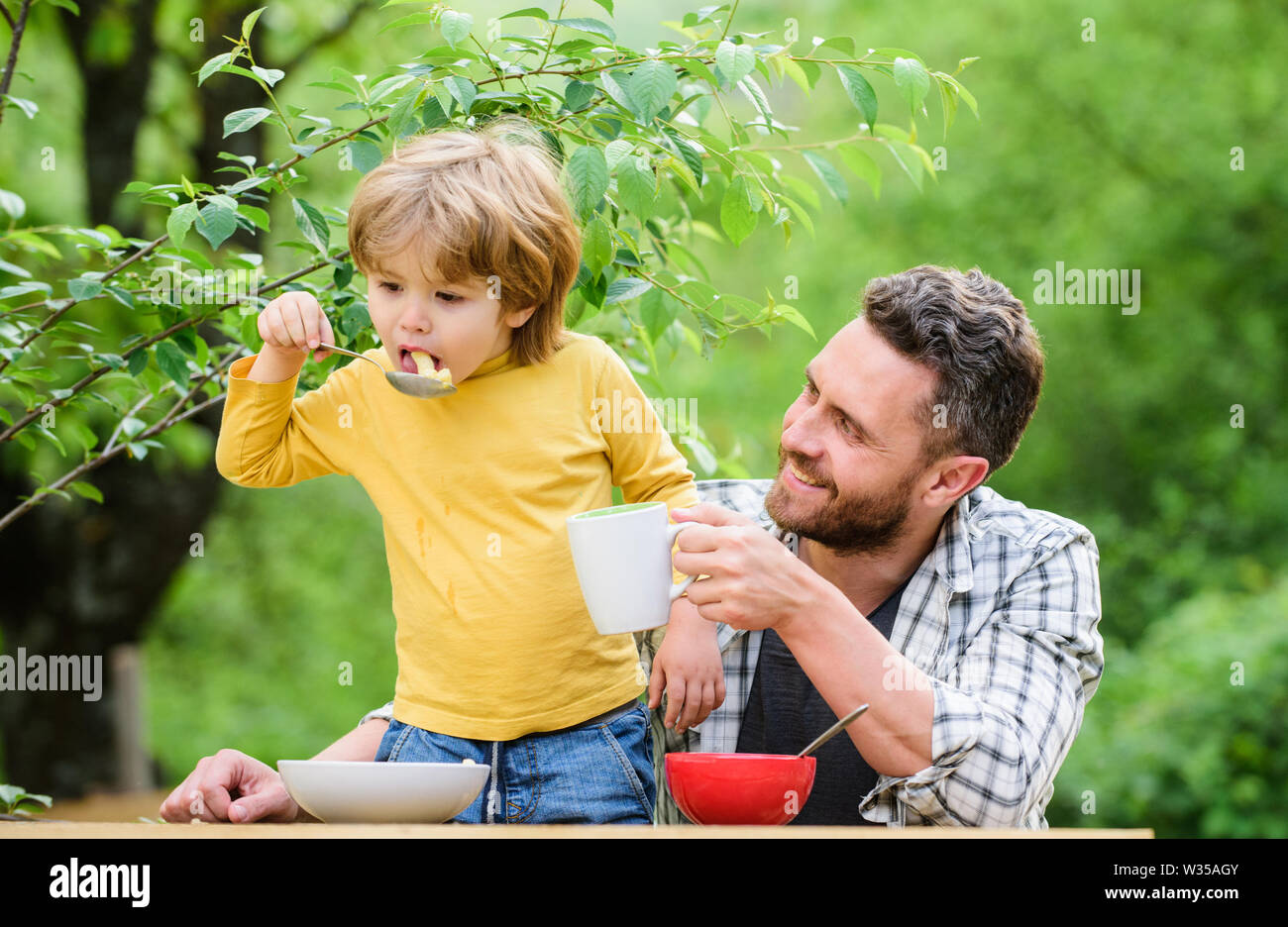 Father son eat food and have fun. Menu for children. Family enjoy ...
