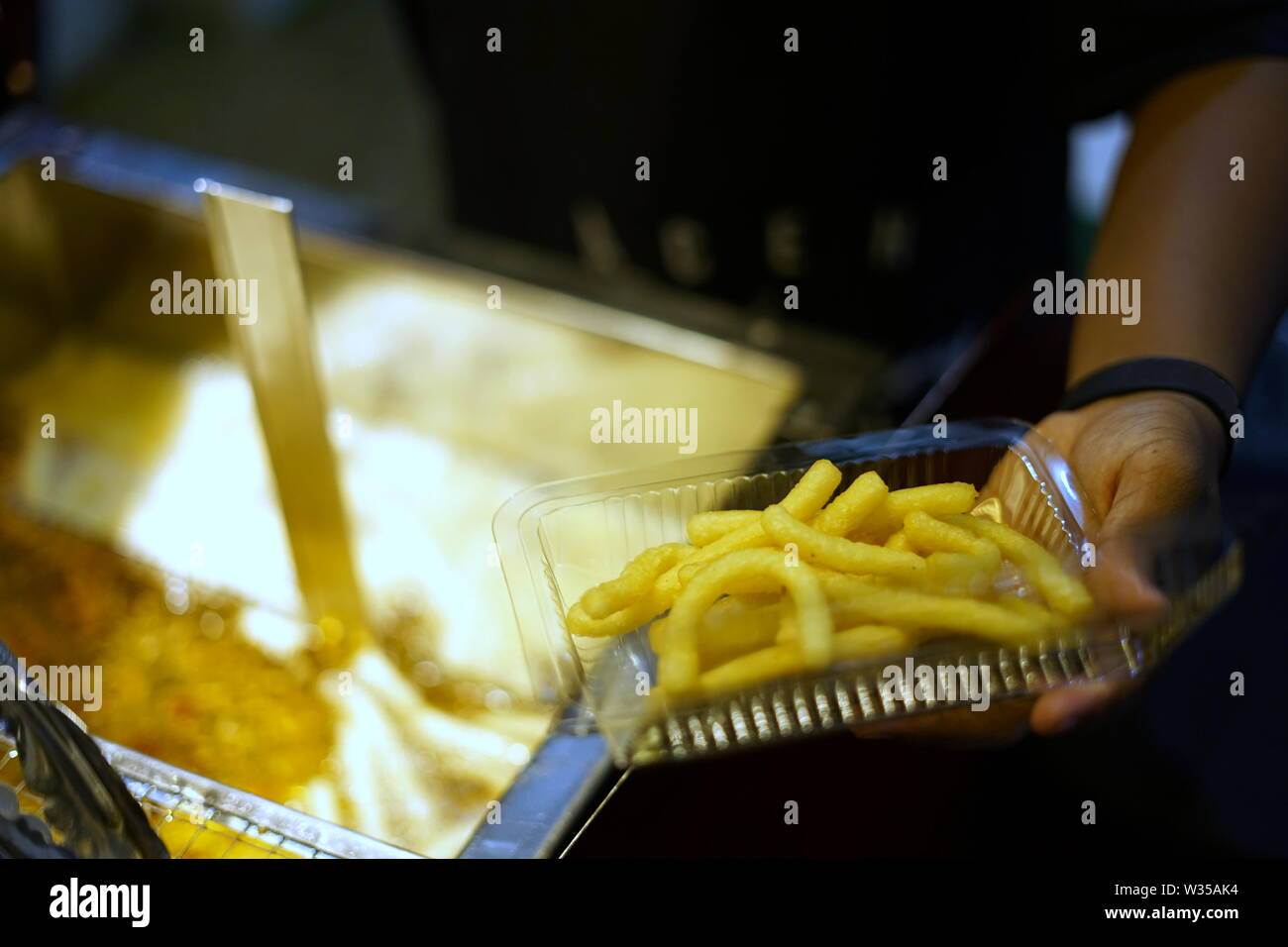 Fast Food French Fries in Deep Fryer at local night market Stock Photo ...