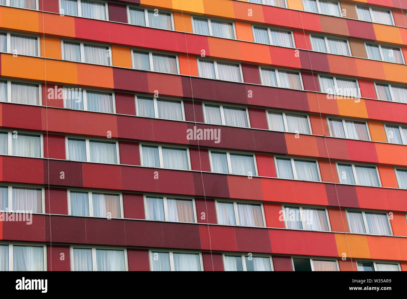 Coloured building with a lot of windows Stock Photo - Alamy