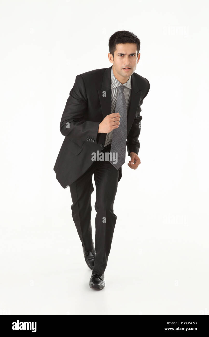 Indian businessman running hi-res stock photography and images - Alamy