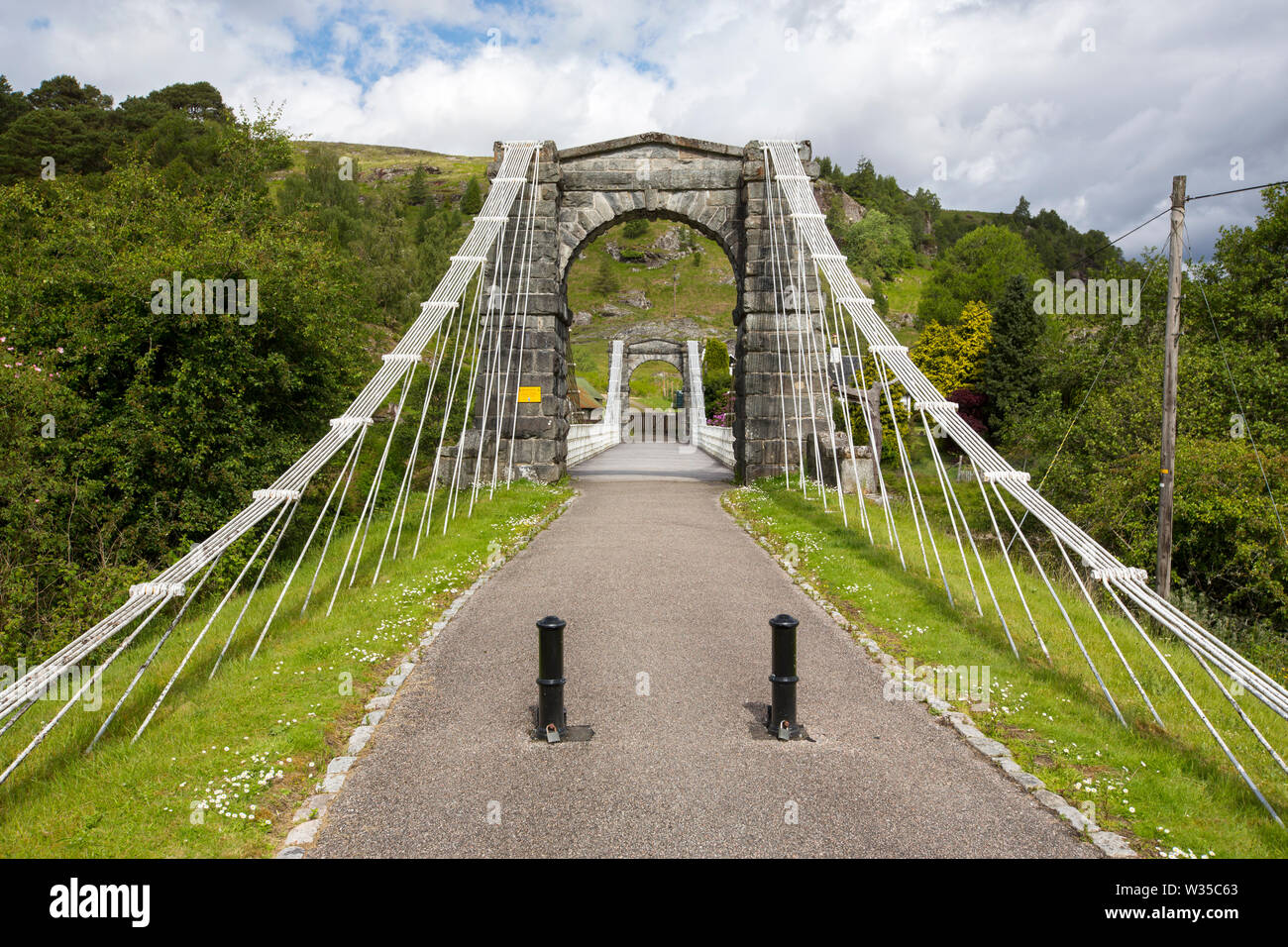 A suspension bridge over the River Oich at Bridge of Oich, near Fort ...
