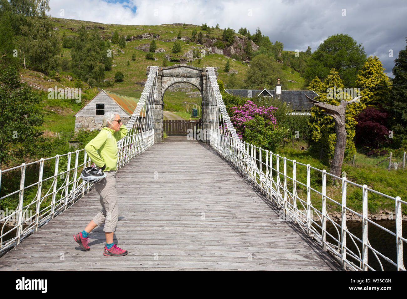 A suspension bridge over the River Oich at Bridge of Oich, near Fort ...