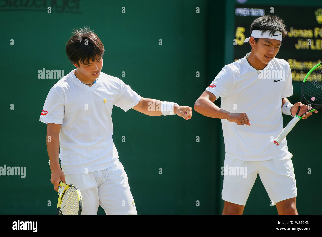 Wimbledon, London, UK. 12th July 2019. Shunsuke Mitsui and Keisuke Saitoh of Japan during the ...