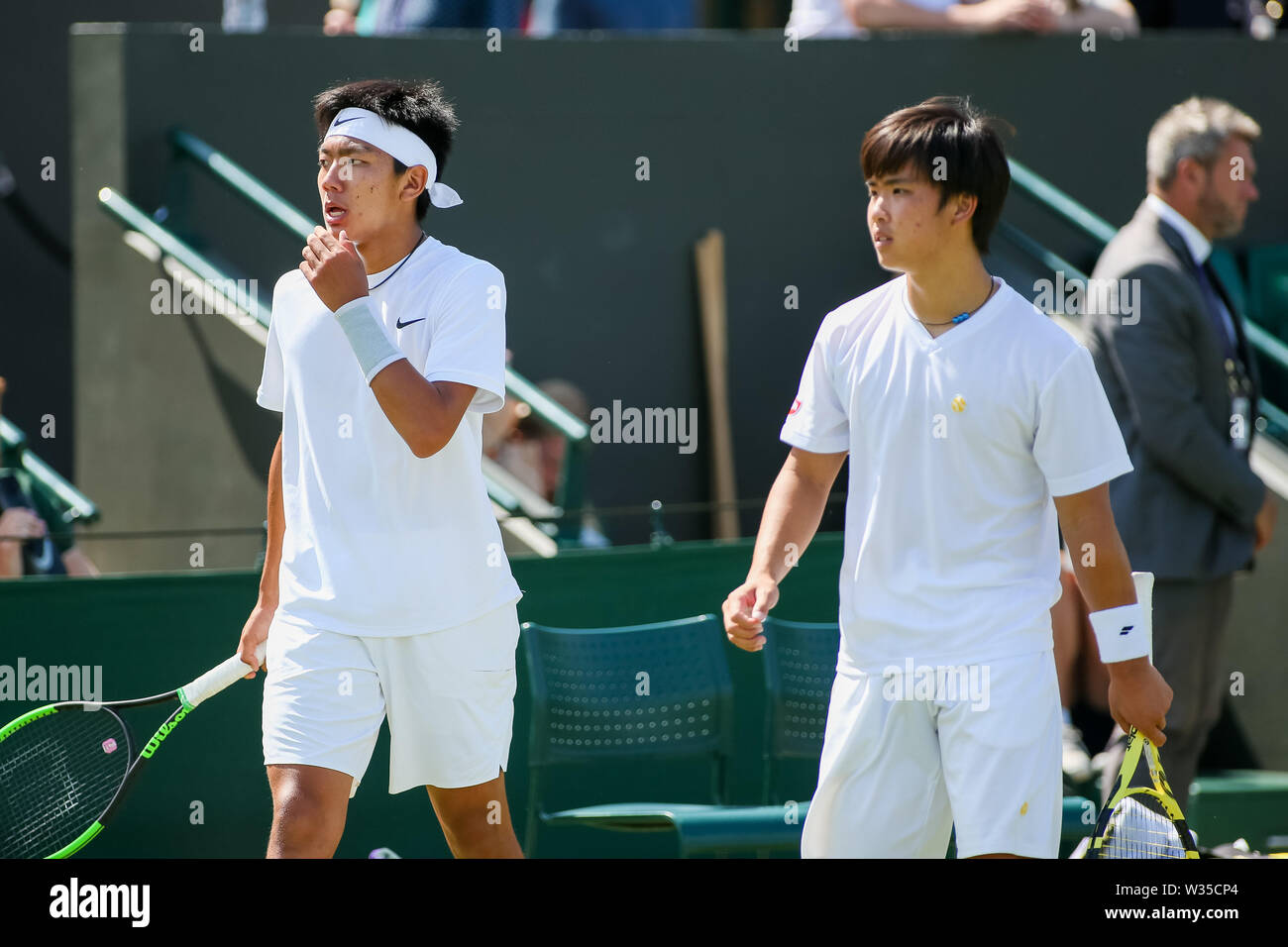 Wimbledon, London, UK. 12th July 2019. Shunsuke Mitsui and Keisuke Saitoh of Japan during the ...