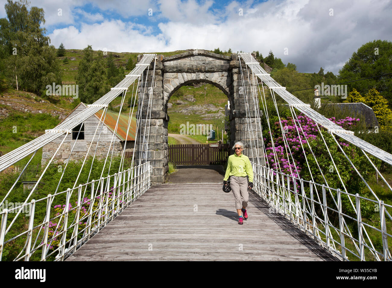 A suspension bridge over the River Oich at Bridge of Oich, near Fort ...