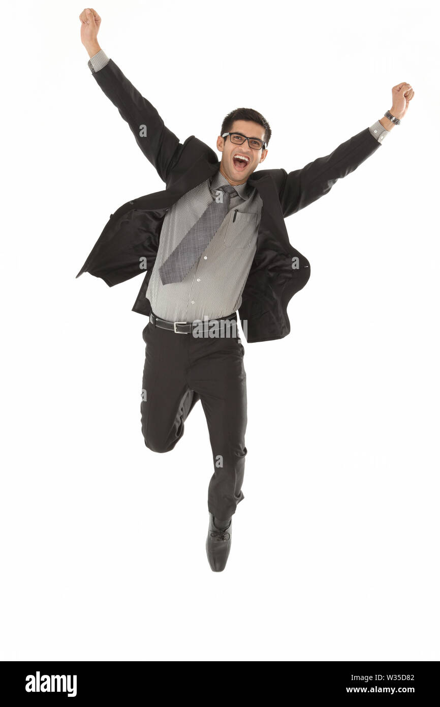 Portrait of a businessman running and smiling Stock Photo - Alamy