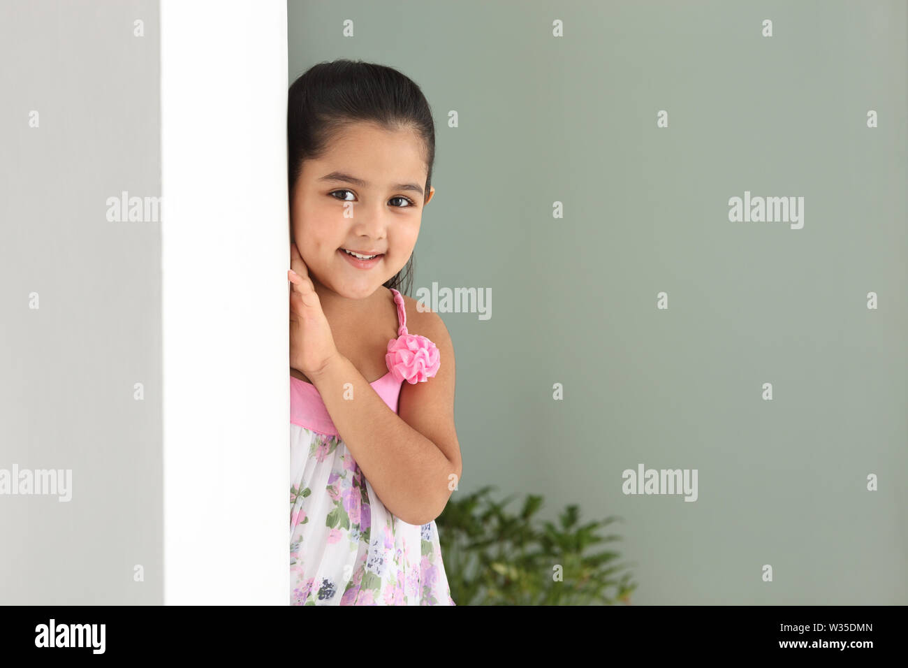 Portrait indian girl hiding behind hi-res stock photography and images ...