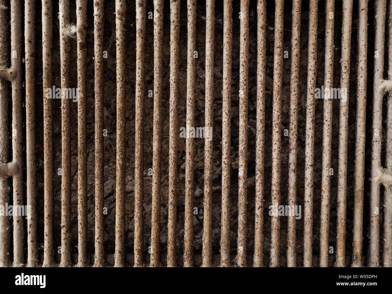 Closeup view of old and rusty grill bars, details of texture in focus ...