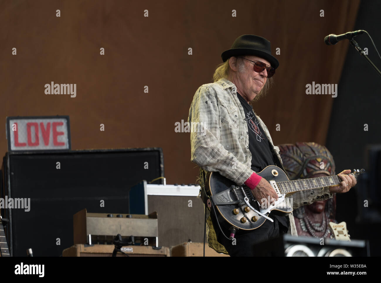 London, UK. Friday, 12 July, 2019. Neil Young performing on stage in ...