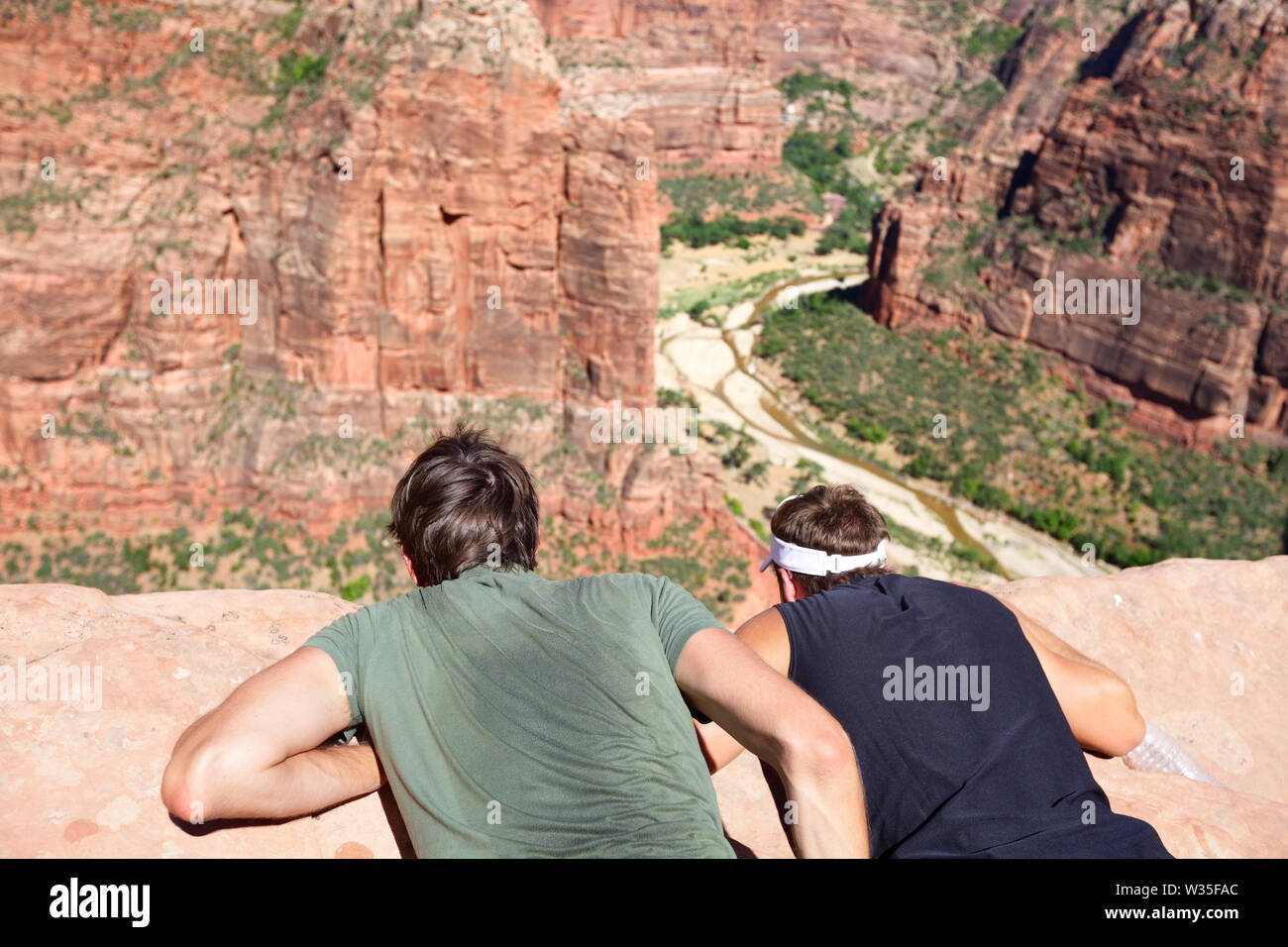 Hikers at Angels Landing Observation point looking down Zion Canyon ...