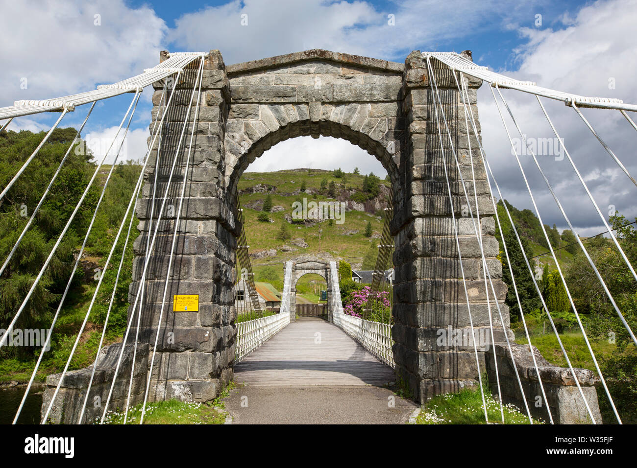 A suspension bridge over the River Oich at Bridge of Oich, near Fort ...