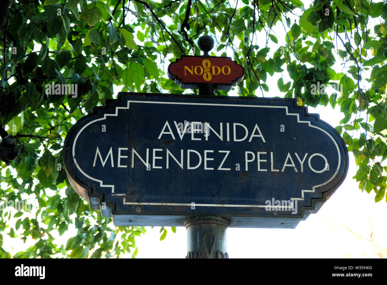 Street sign for Menendez Pelayo avenue with the NO8DO symbol in Seville ...