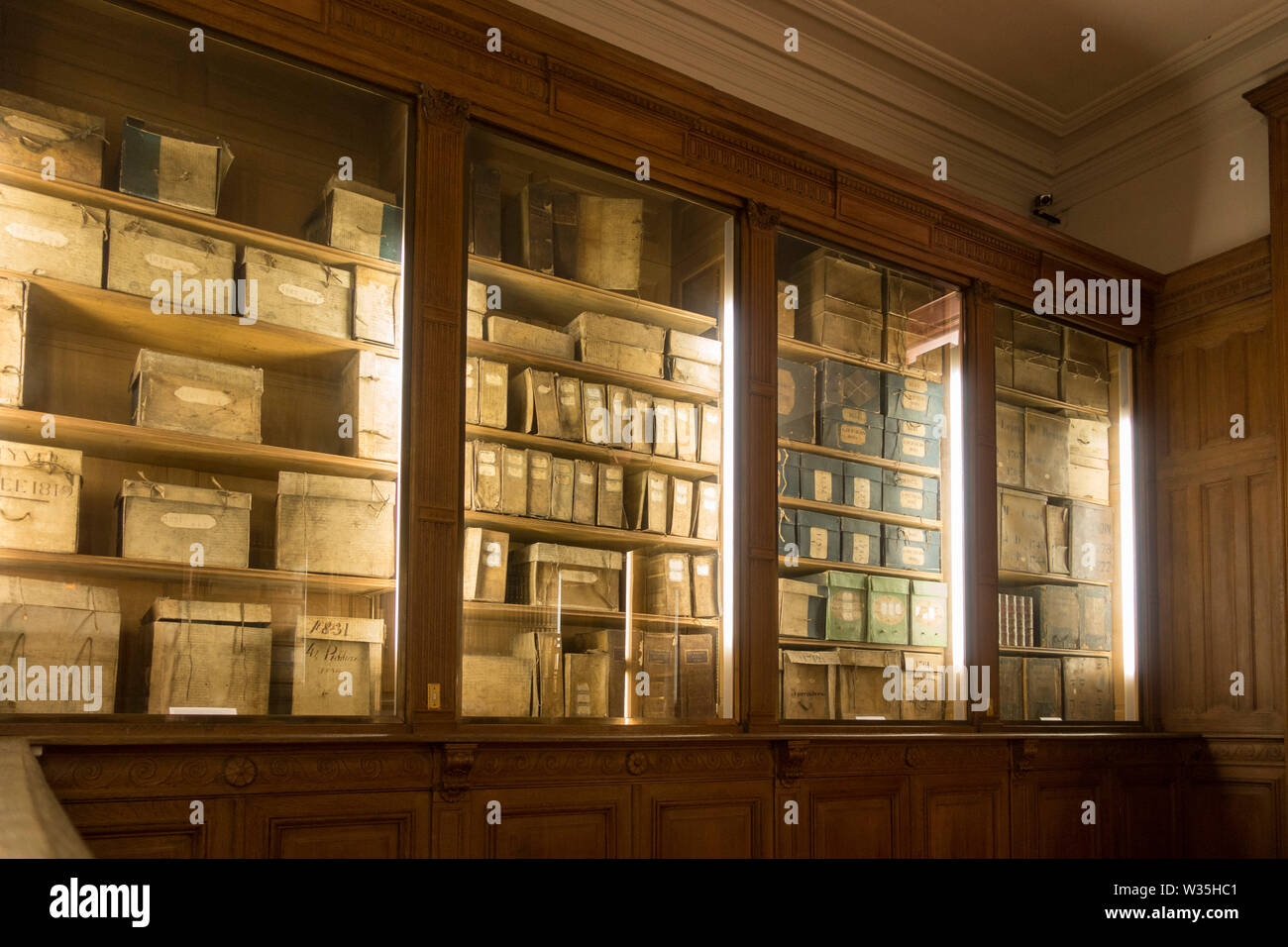 Antique books in library room. Interior of National Archives Building ...