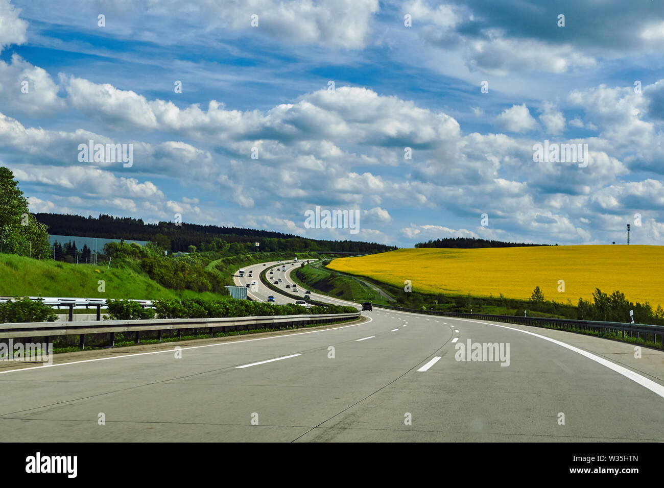 Rural landscape and cars on the highway in Germany Stock Photo - Alamy
