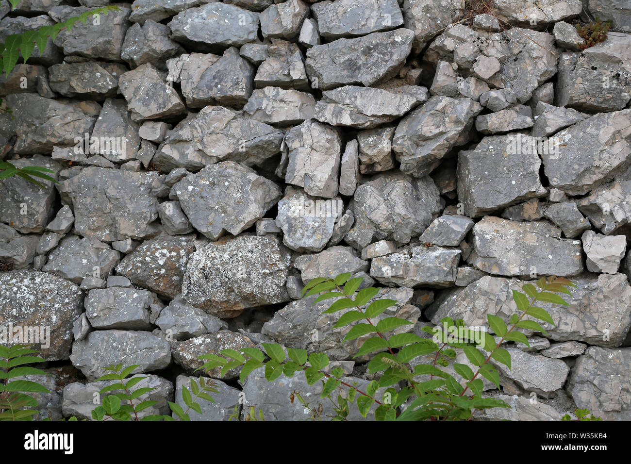Grey stone wall. Wall made of natural stone Stock Photo - Alamy