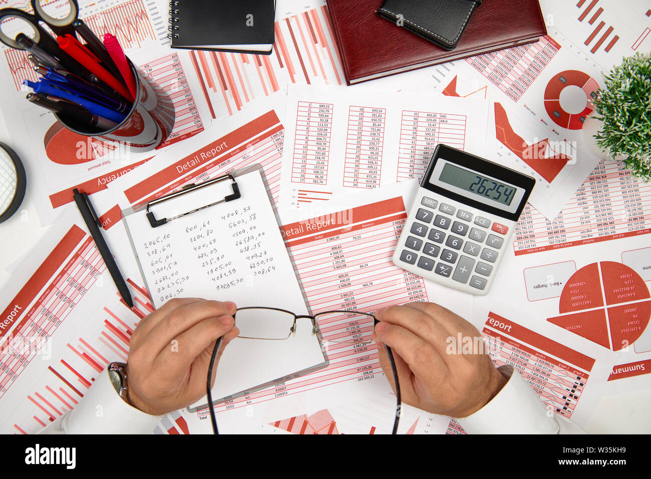 Business reports, data tables and charts - directly above view of ...