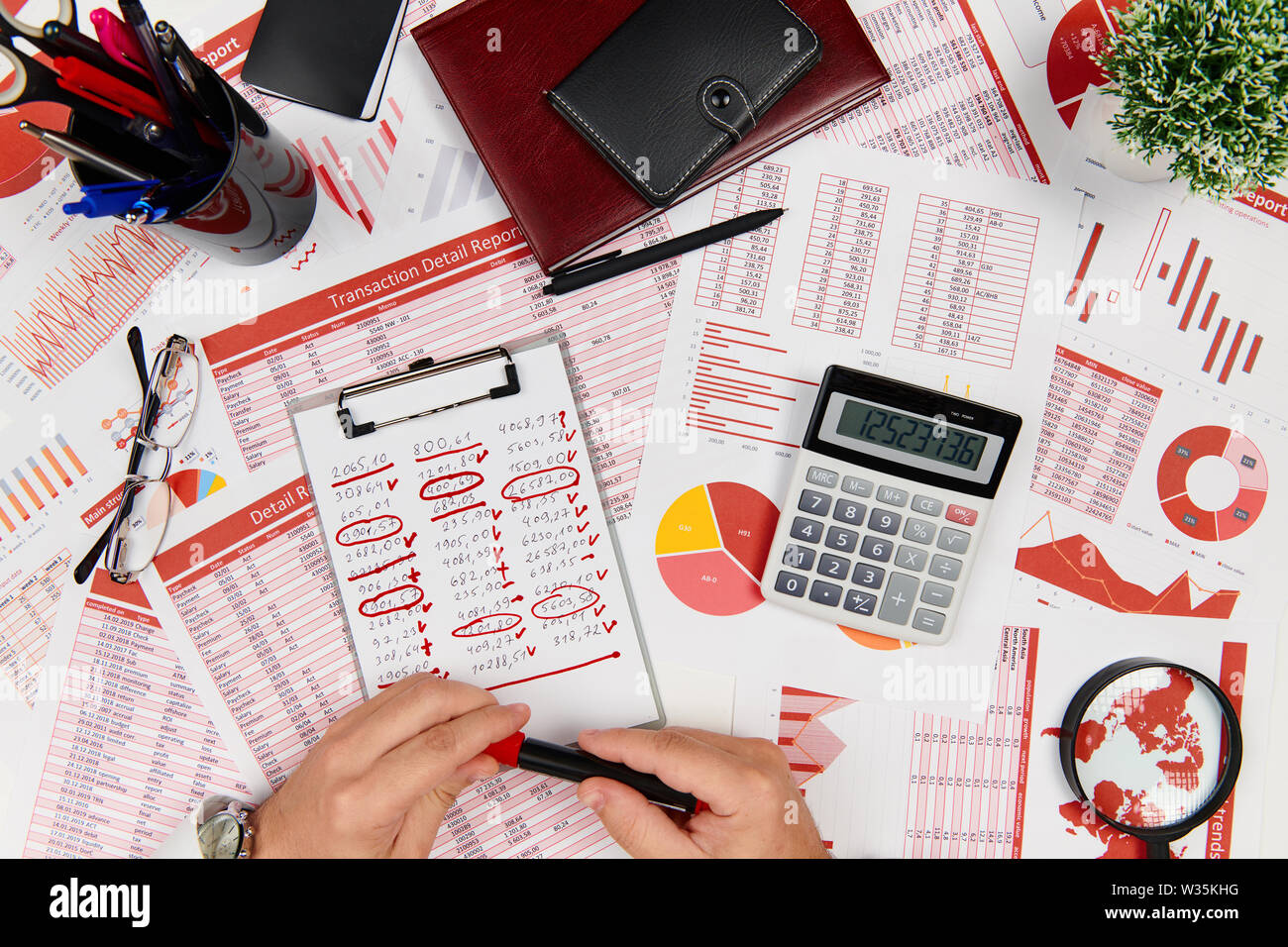 Business reports, data tables and charts - directly above view of ...